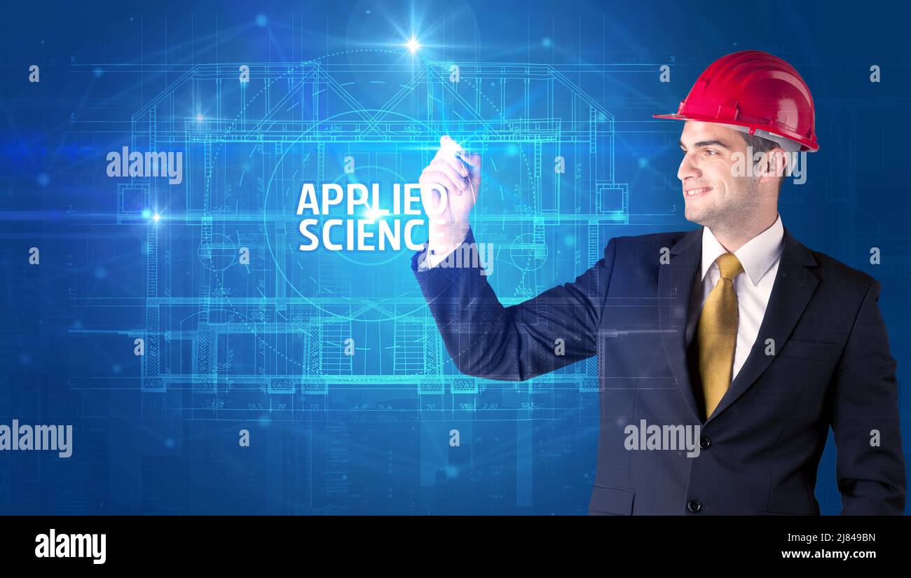 Handsome architect drawing with helmet Stock Photo - Alamy