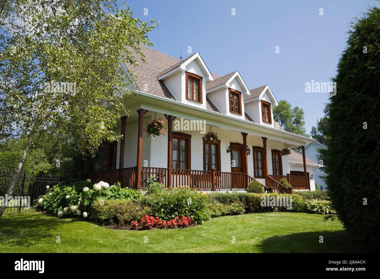 Replica of old 1860s Canadiana cottage style white stucco home with ...