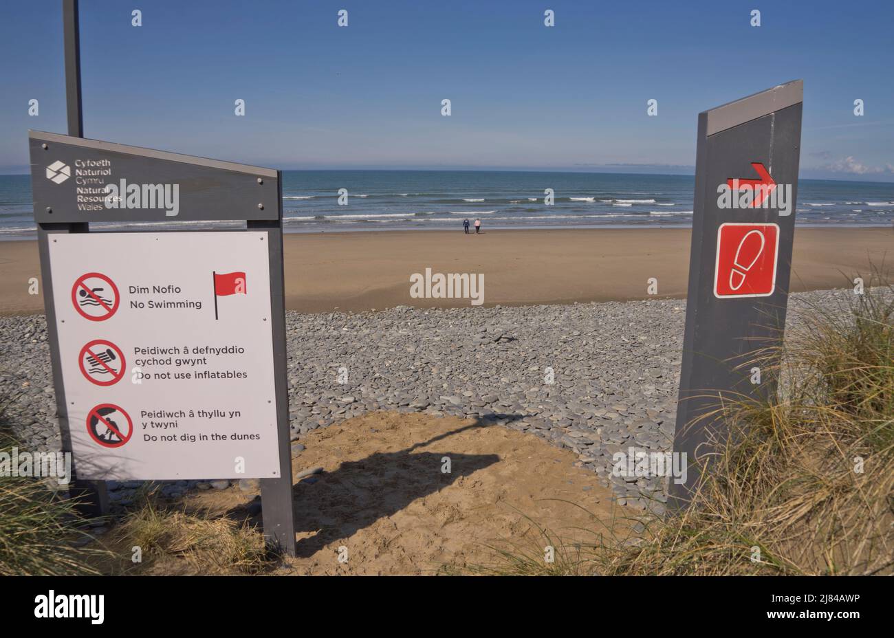 Bilingual Welsh/English sign by sand dunes at the beach in Ynyslas at ...