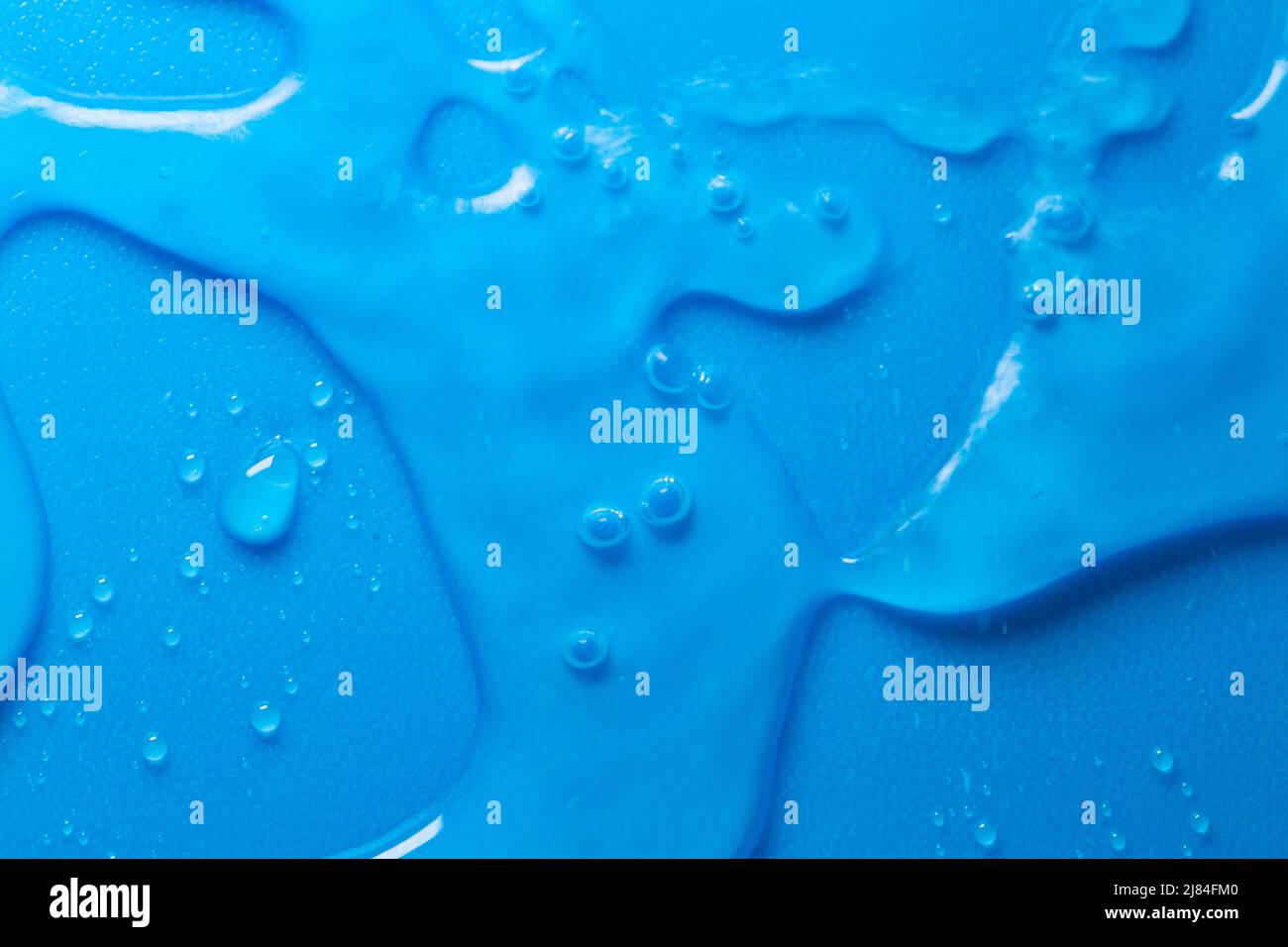 Water jets and drops background. Water drip surface on blue background ...
