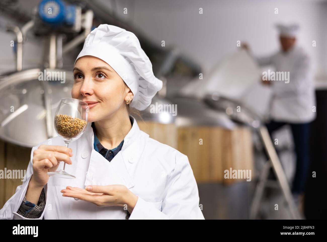 Female smelling malt seeds Stock Photo - Alamy