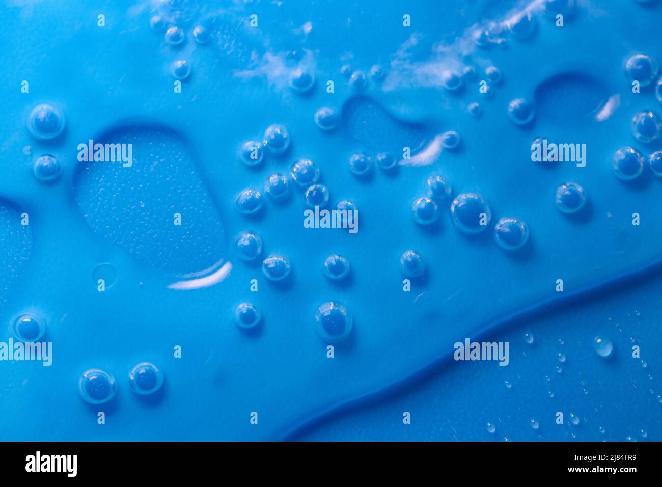 Water drip blue background. Water texture. Water jets and drops ...