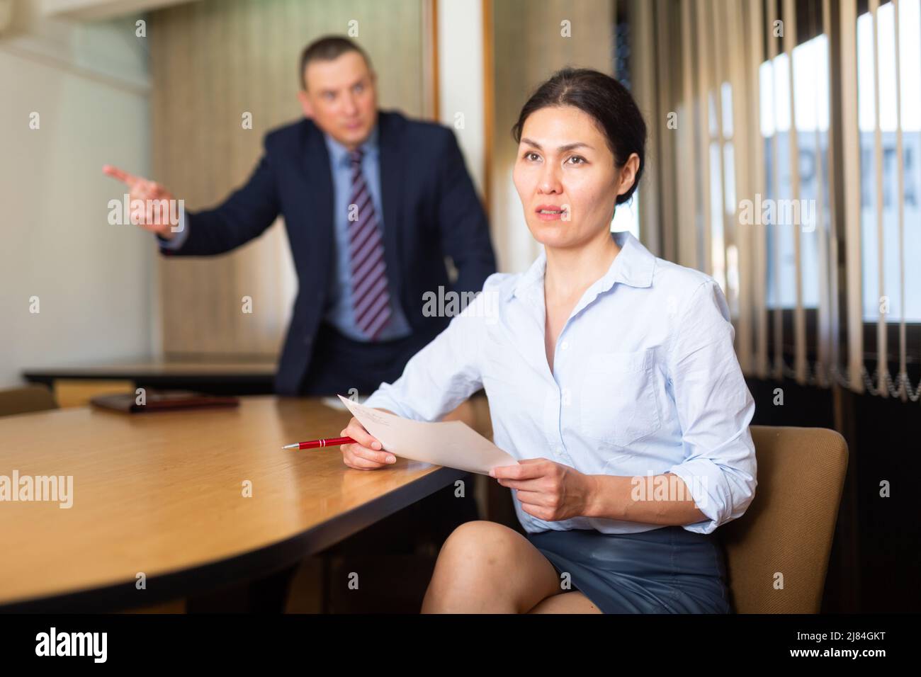 Angry boss firing female colleague hi-res stock photography and images ...