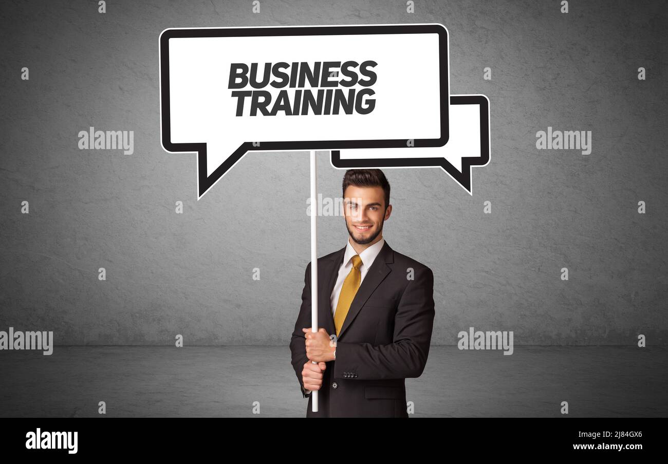 business person in casual holding road sign Stock Photo - Alamy