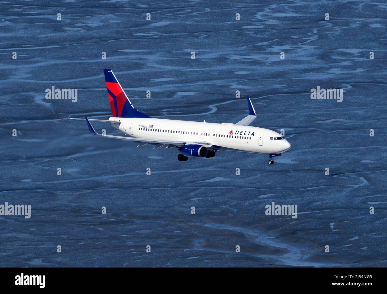 Delta Airlines Boeing 737-800 airplane over water. Aircraft 737 of ...
