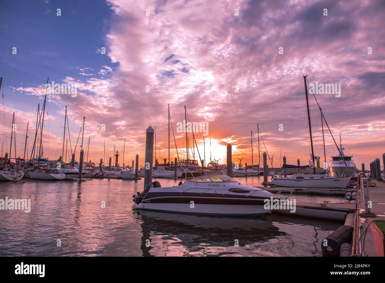 The wonderful and colorful port at sunset time Stock Photo - Alamy