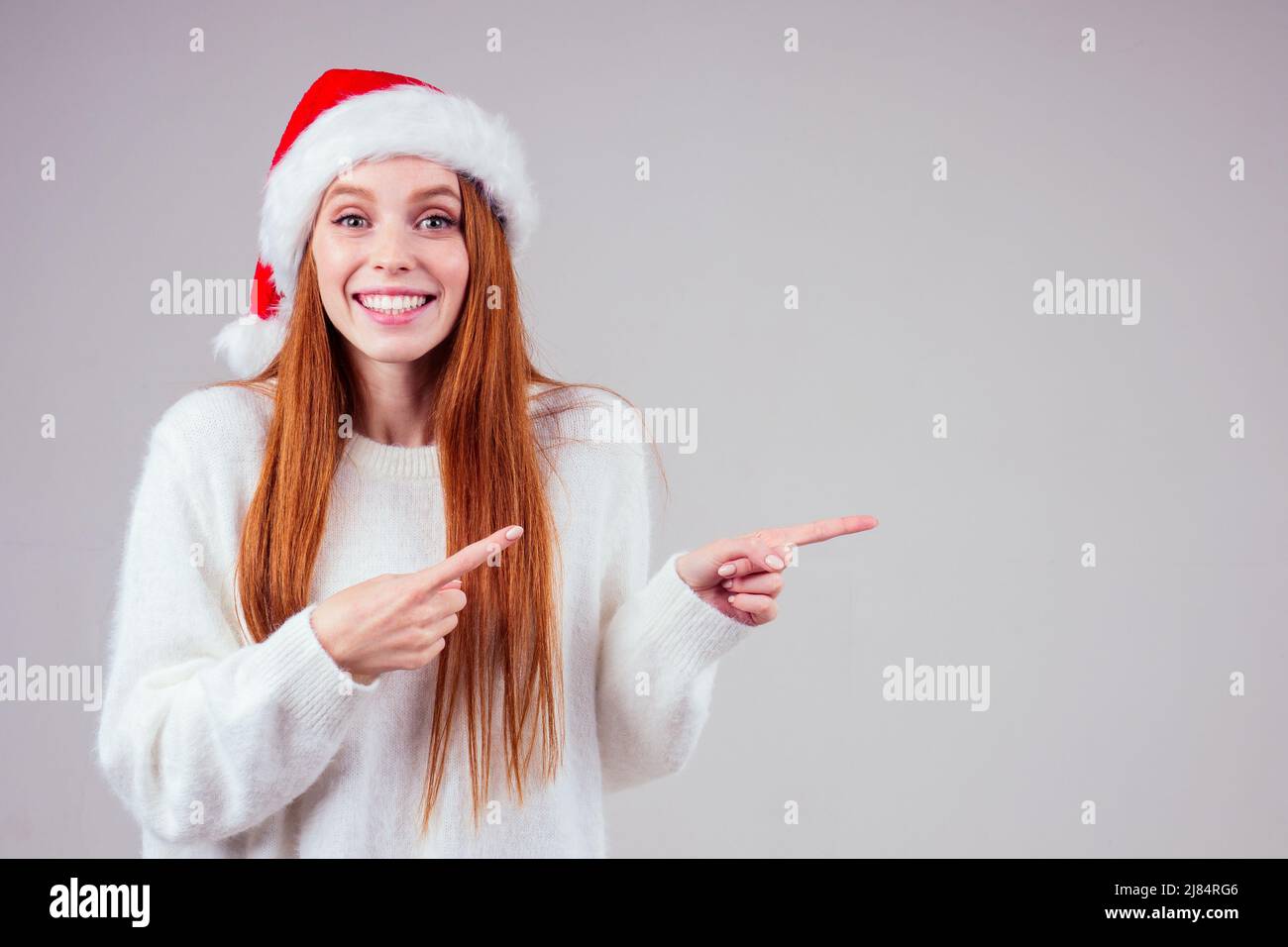 beautiful redhaired ginger woman wearing white knitted sweater and ...