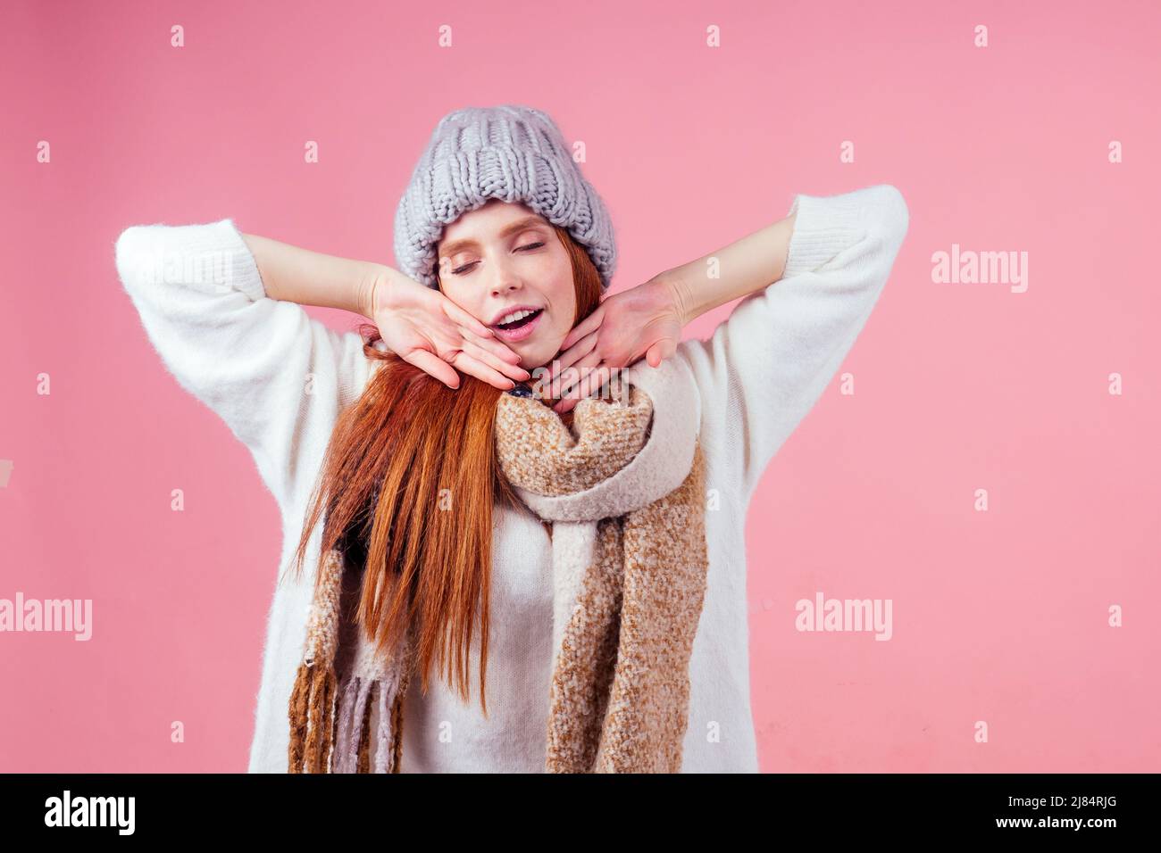 redhaired ginger woman yawning and stretching the body after winter ...