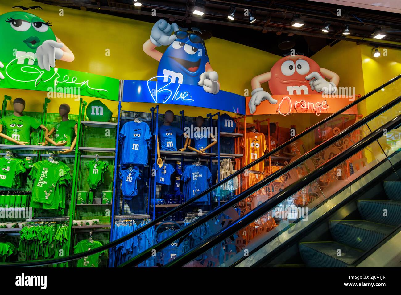 Variety of colored clothes and souvenirs . The MM store in Manhattan ...