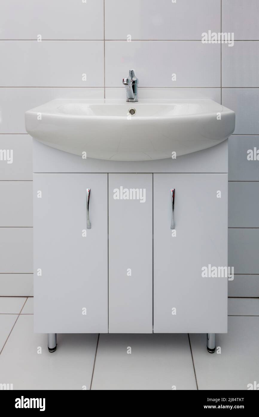 Floor stand with washbasin in bathroom with tile Stock Photo - Alamy
