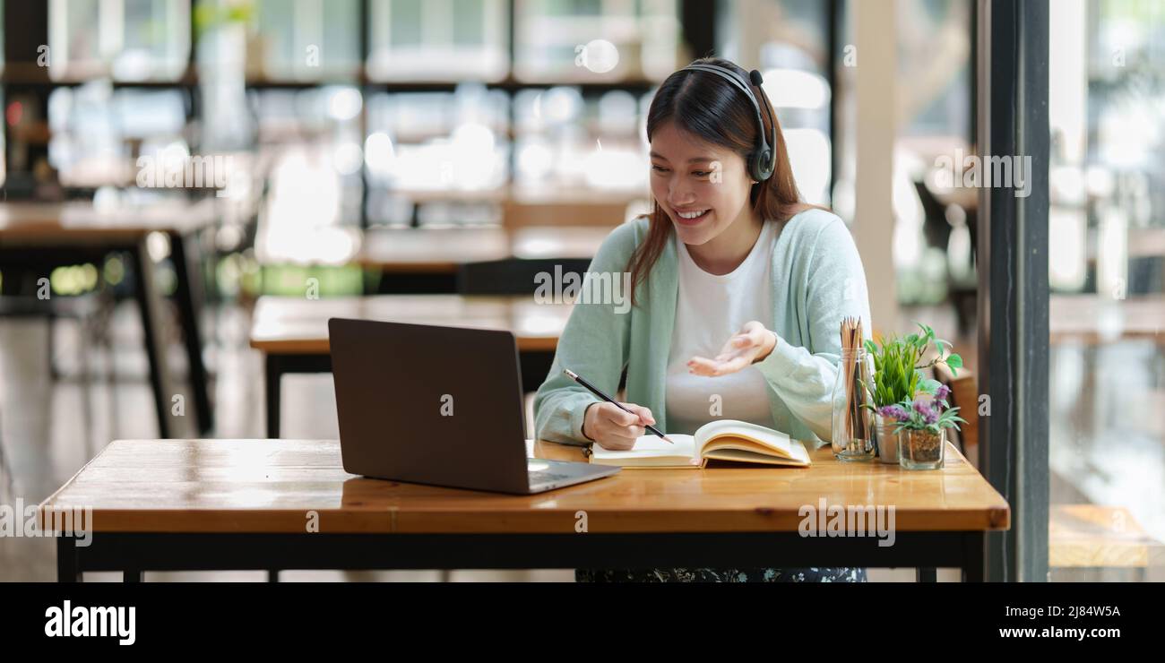 Young college student have question and answer to teacher by video call ...