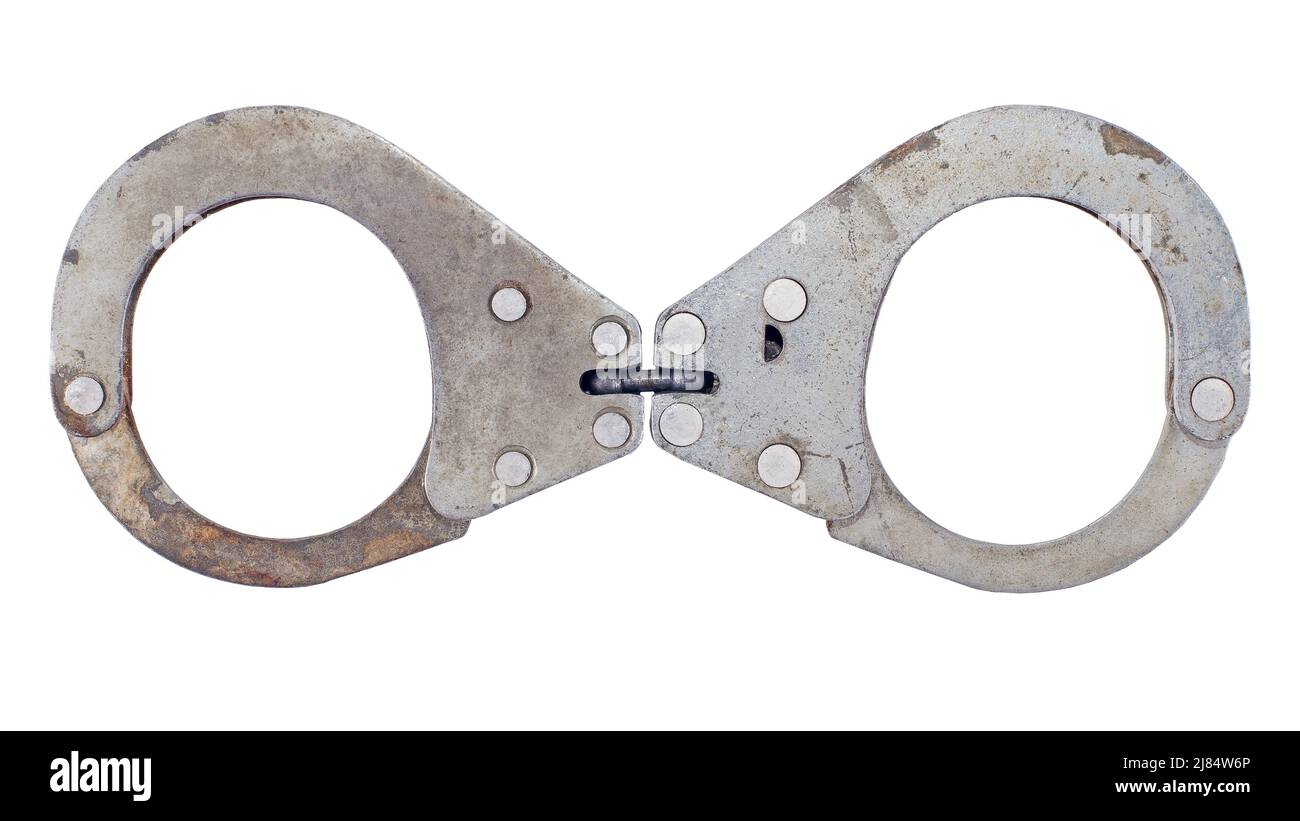 Iron handcuffs. Isolated on white Stock Photo - Alamy