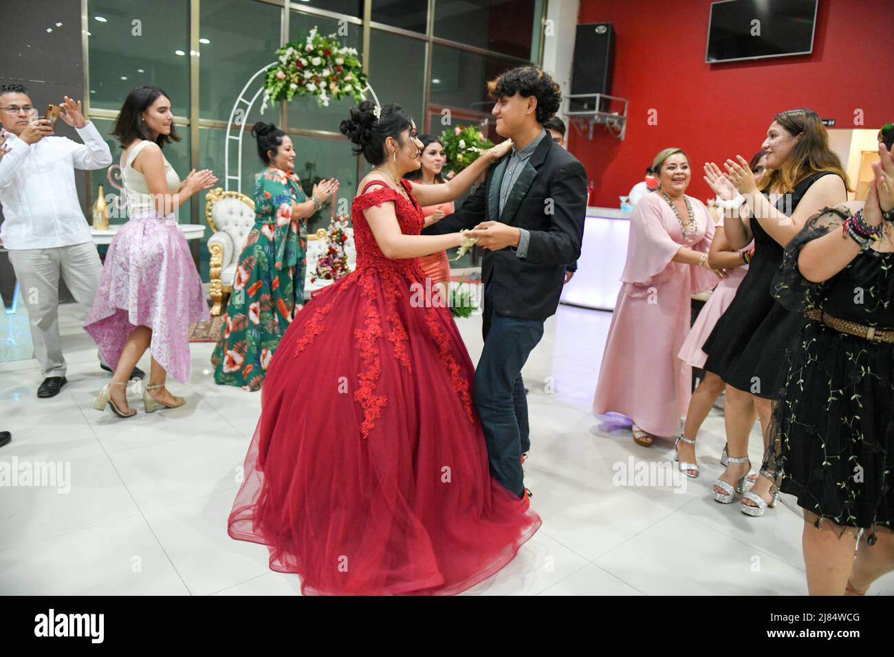 Friends and family dance during the Quinceañera of a Mexican girl's ...