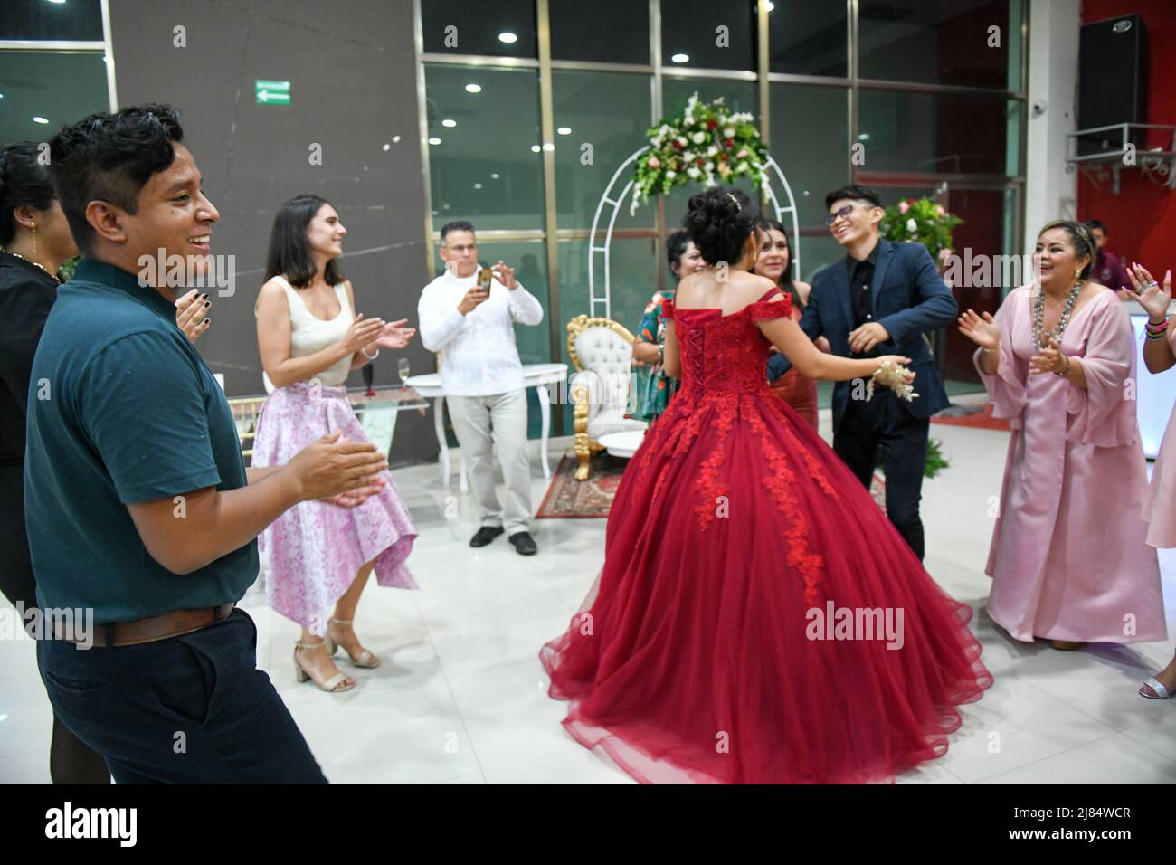 Friends and family dance during the Quinceañera of a Mexican girl's ...