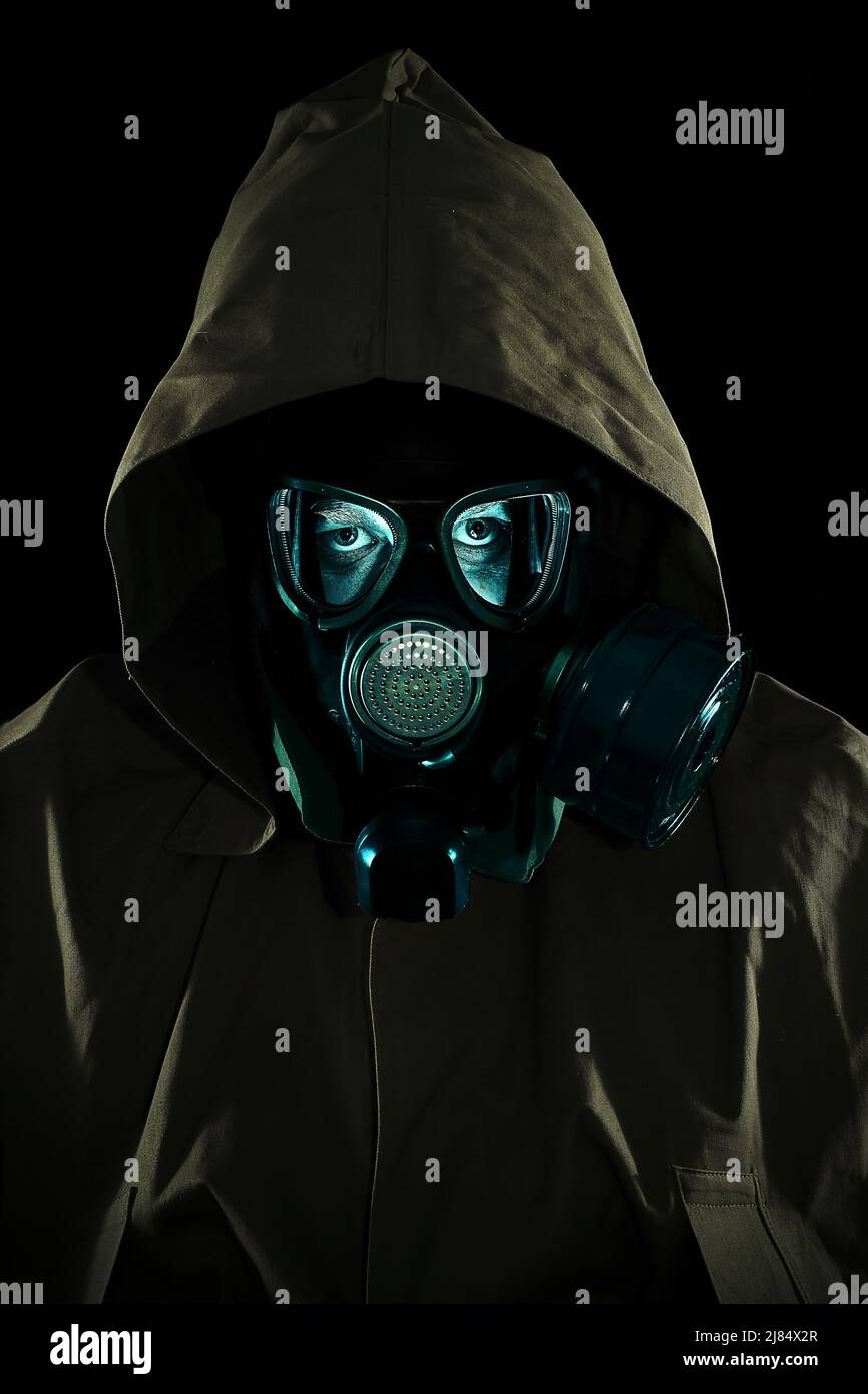 Bust of a man in chemical protection suit with a hood and a gas mask ...
