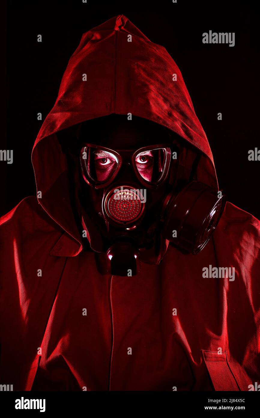 Bust of a man in chemical protection suit with a hood and a gas mask ...