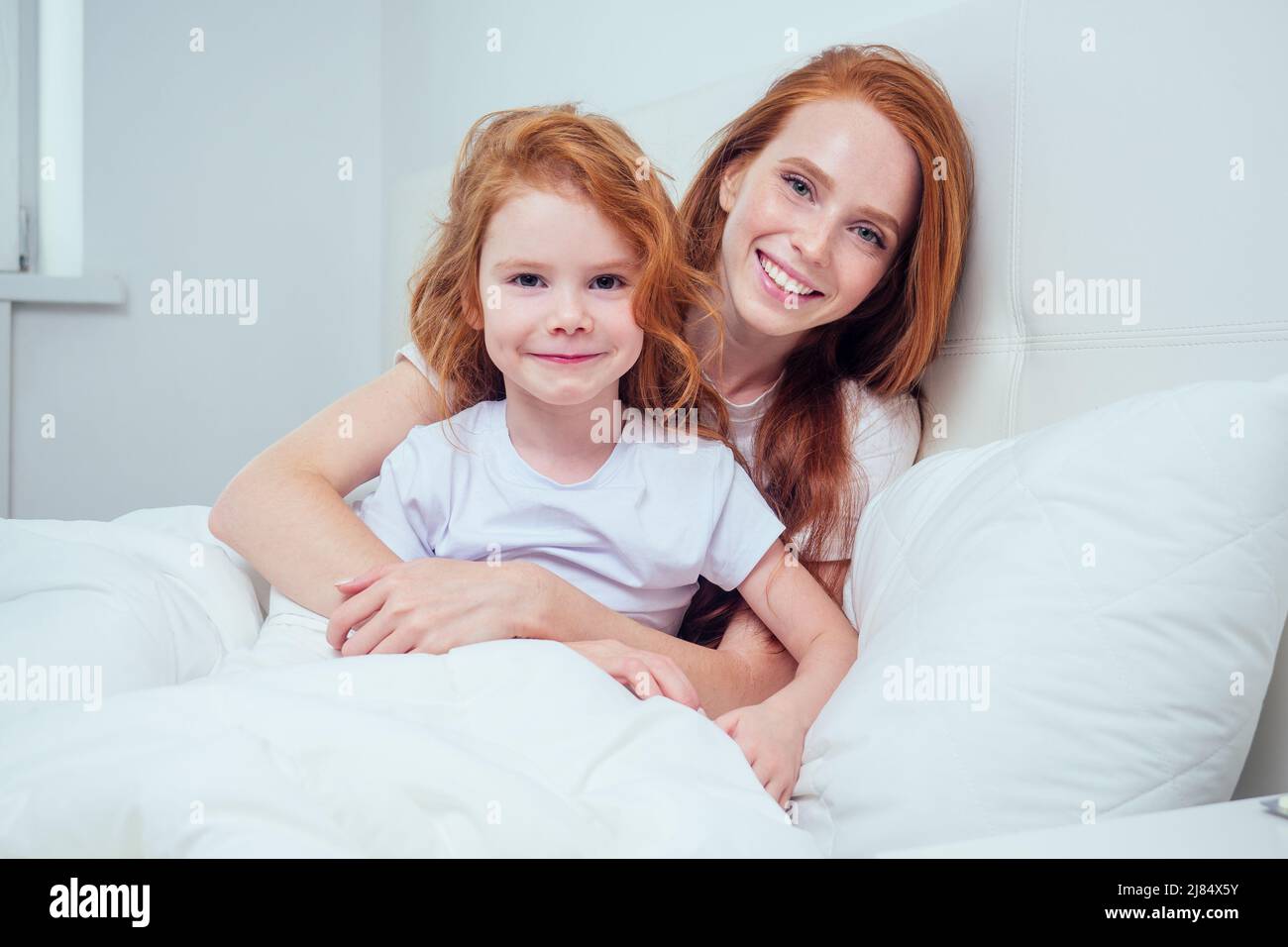 two redhaired ginger sisters playing and hugging at bed Stock Photo - Alamy