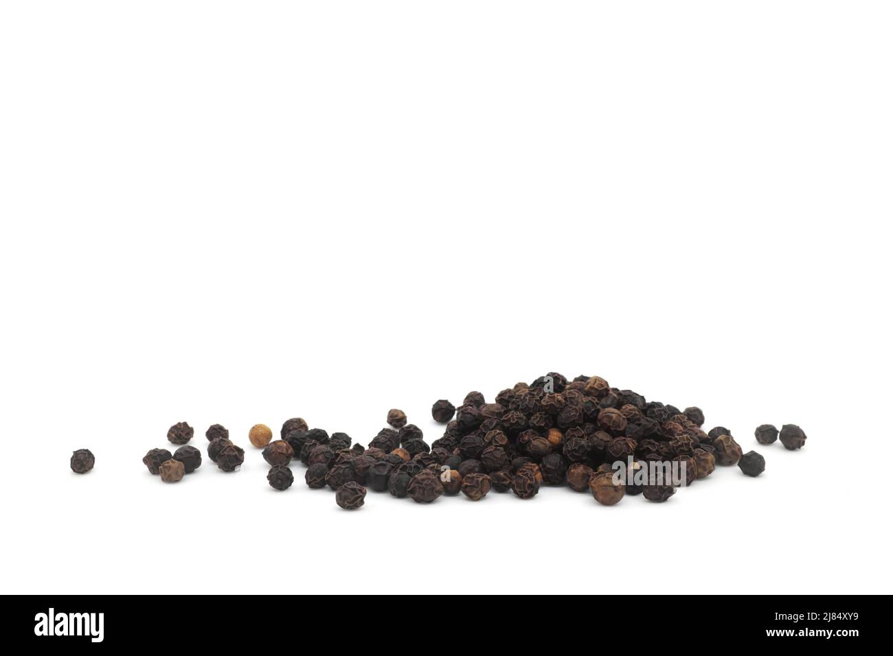 Whole black pepper spice or Piper nigrum dried berries isolated on ...