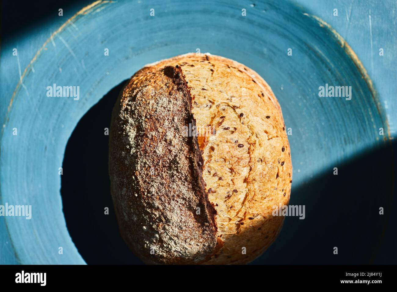 Homemade wheat bread with flax seeds. The concept of homemade bread and ...