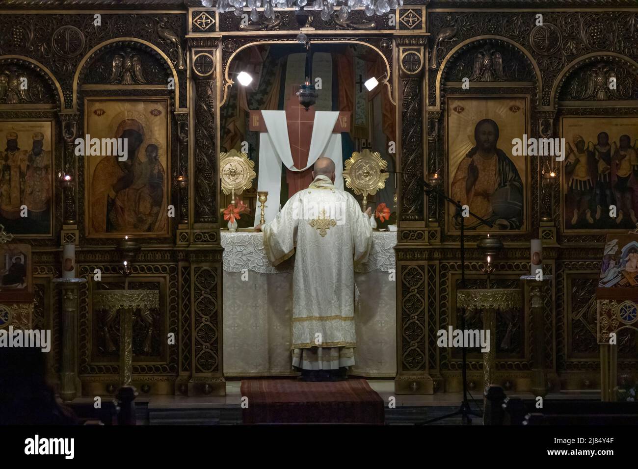 A priest conducts a daily mass inside the Greek Catholic Melkite ...