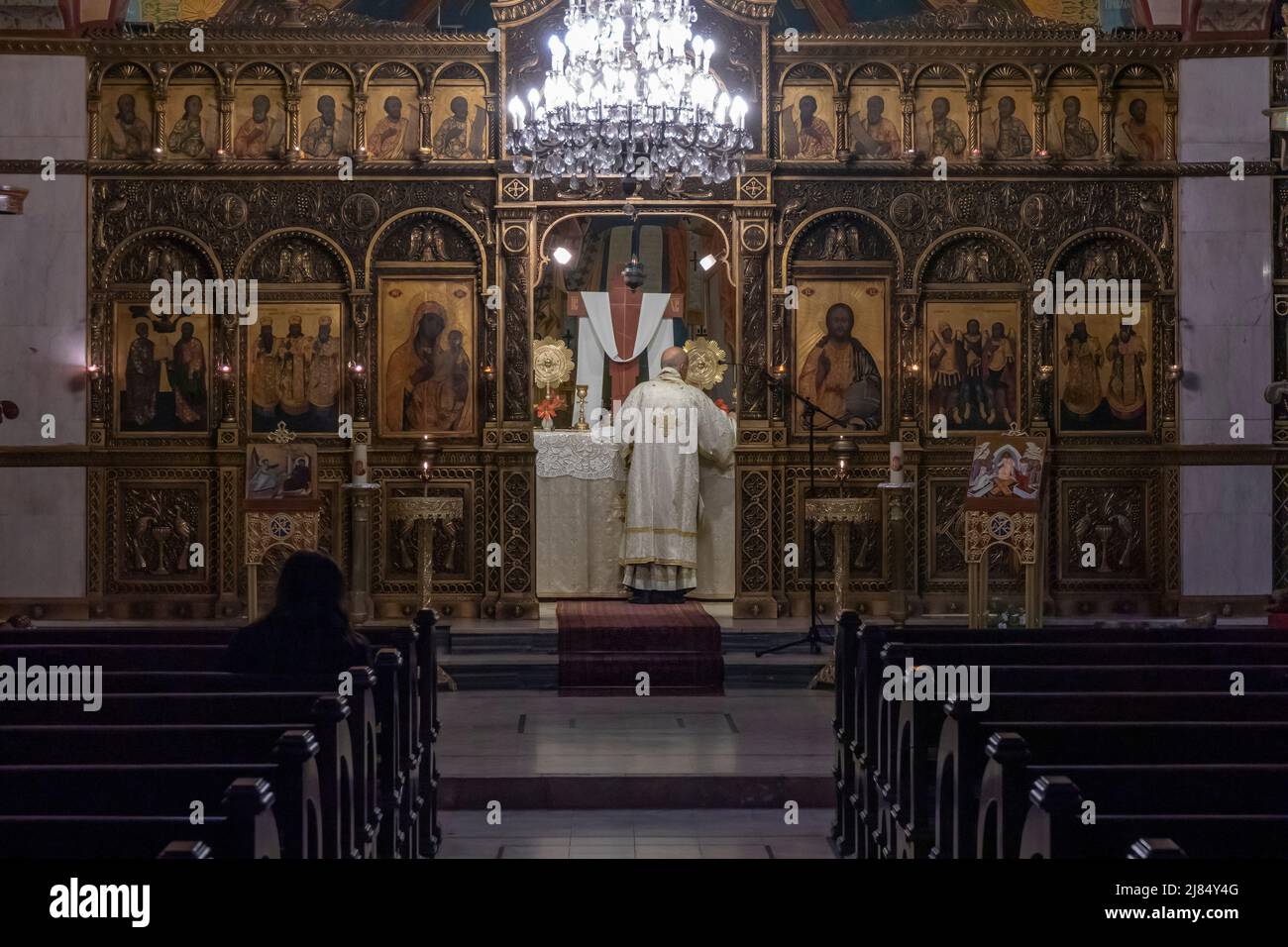 A priest conducts a daily mass inside the Greek Catholic Melkite ...