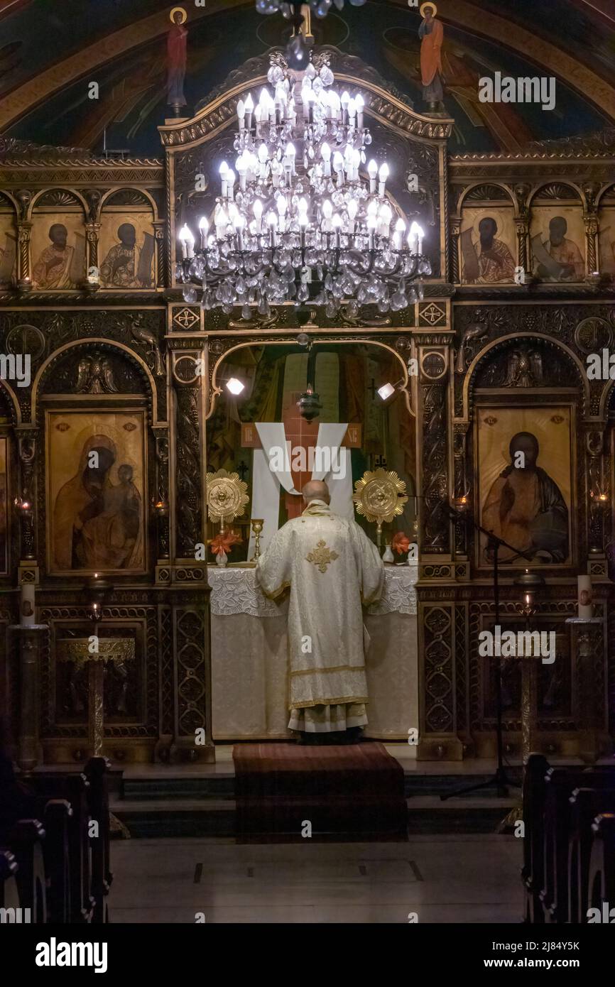 A priest conducts a daily mass inside the Greek Catholic Melkite ...