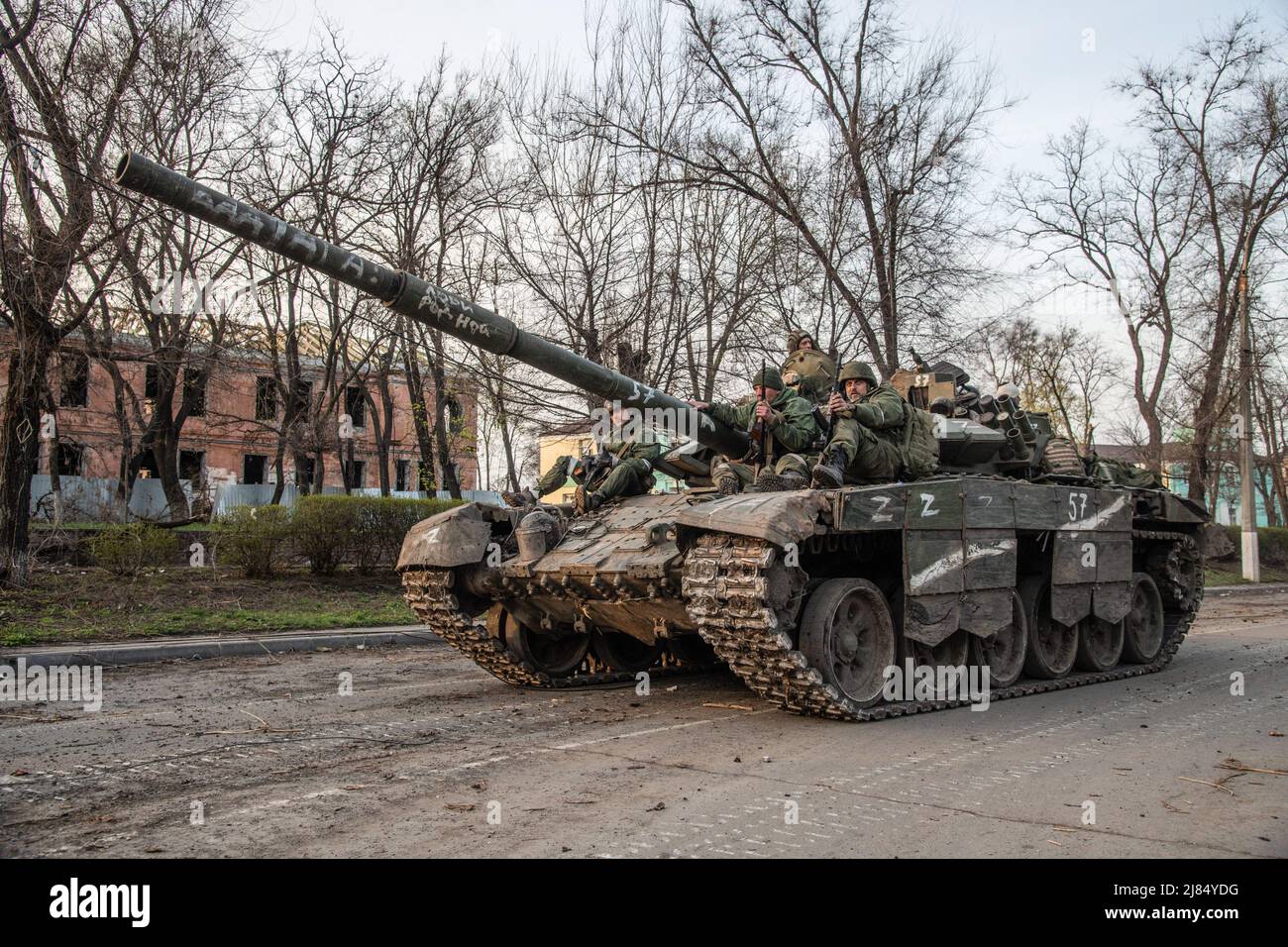 Donetsk People's Republic soldiers atop a T-72 tank heading to the ...