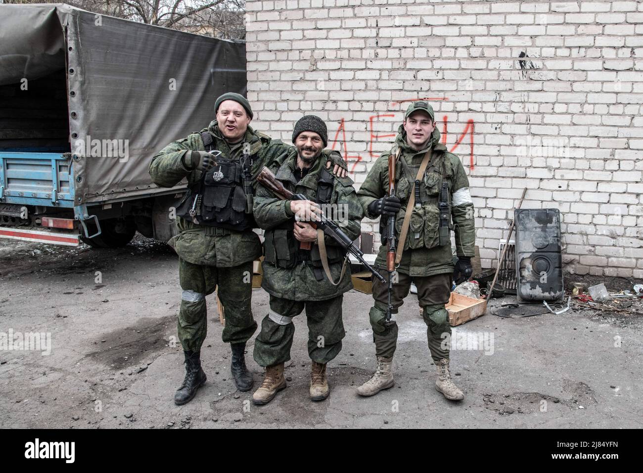 Pro-Russian Donetsk People's Republic soldiers pose outside a makeshift ...