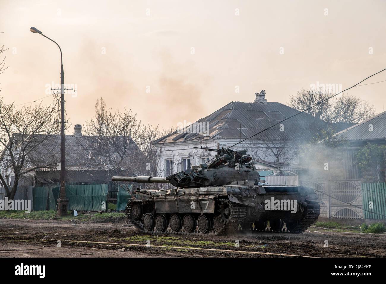 A Russian tank drives through Mariupol. The battle between Russian ...