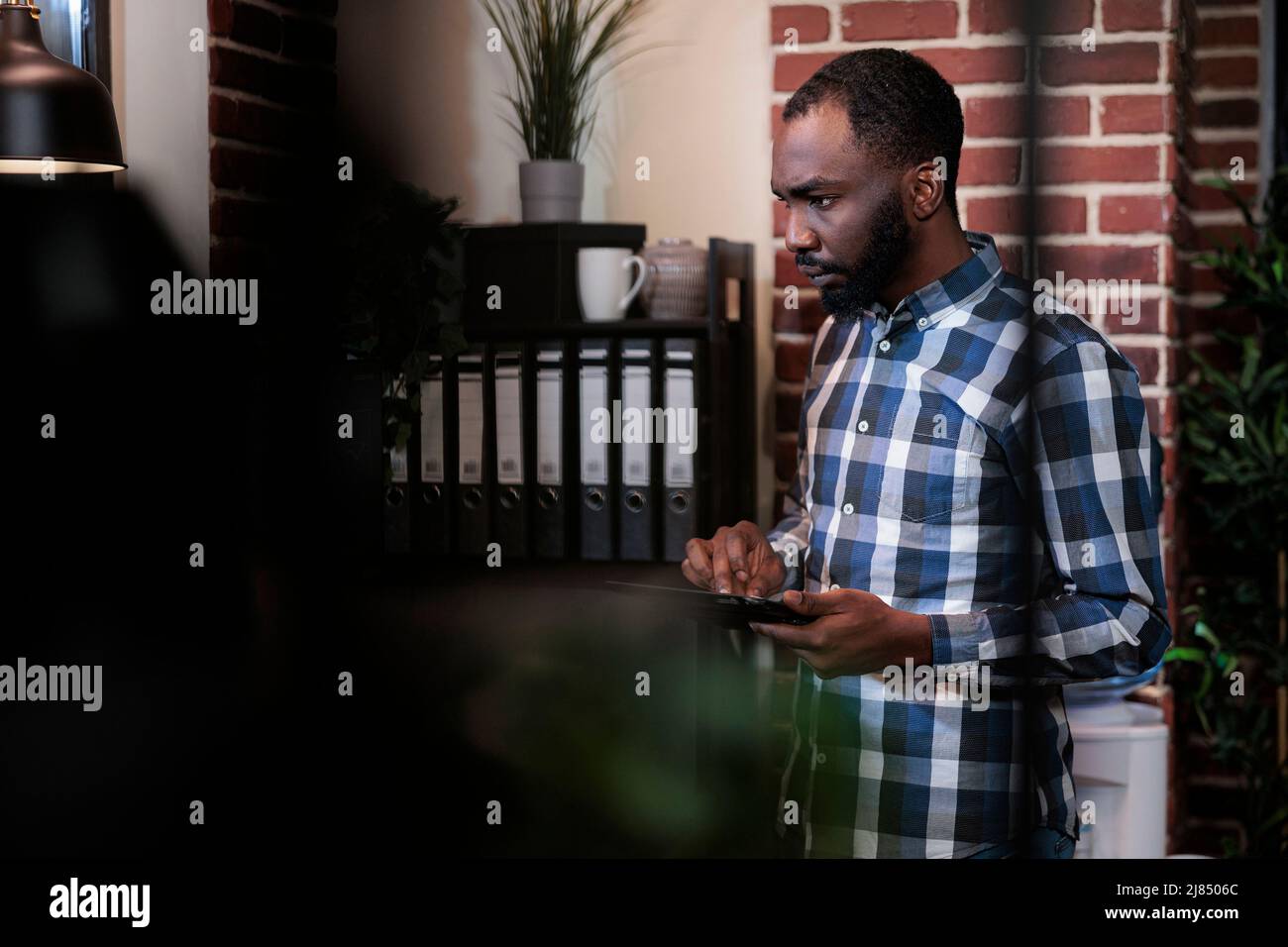 Financial advisor with modern touchscreen gadget analyzing real time ...