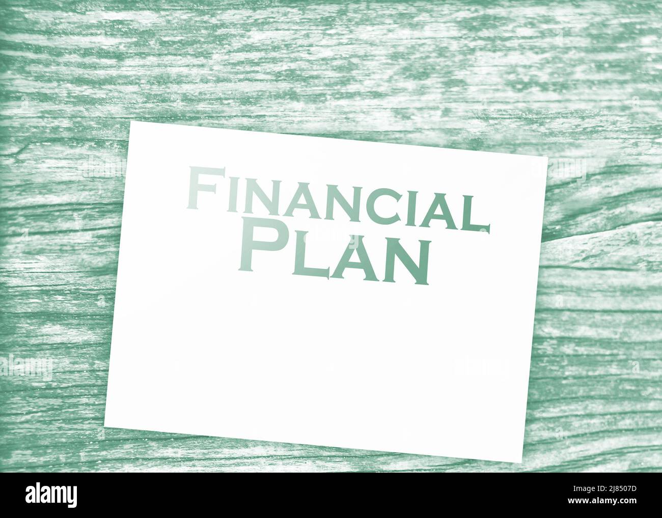 financial plan words on page and paper signs of dollar around. Business ...
