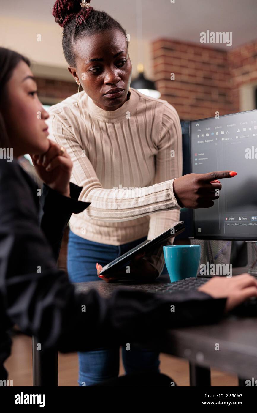 African American Software Developer Pointing Out Cloud Database Processing Algorithm Error