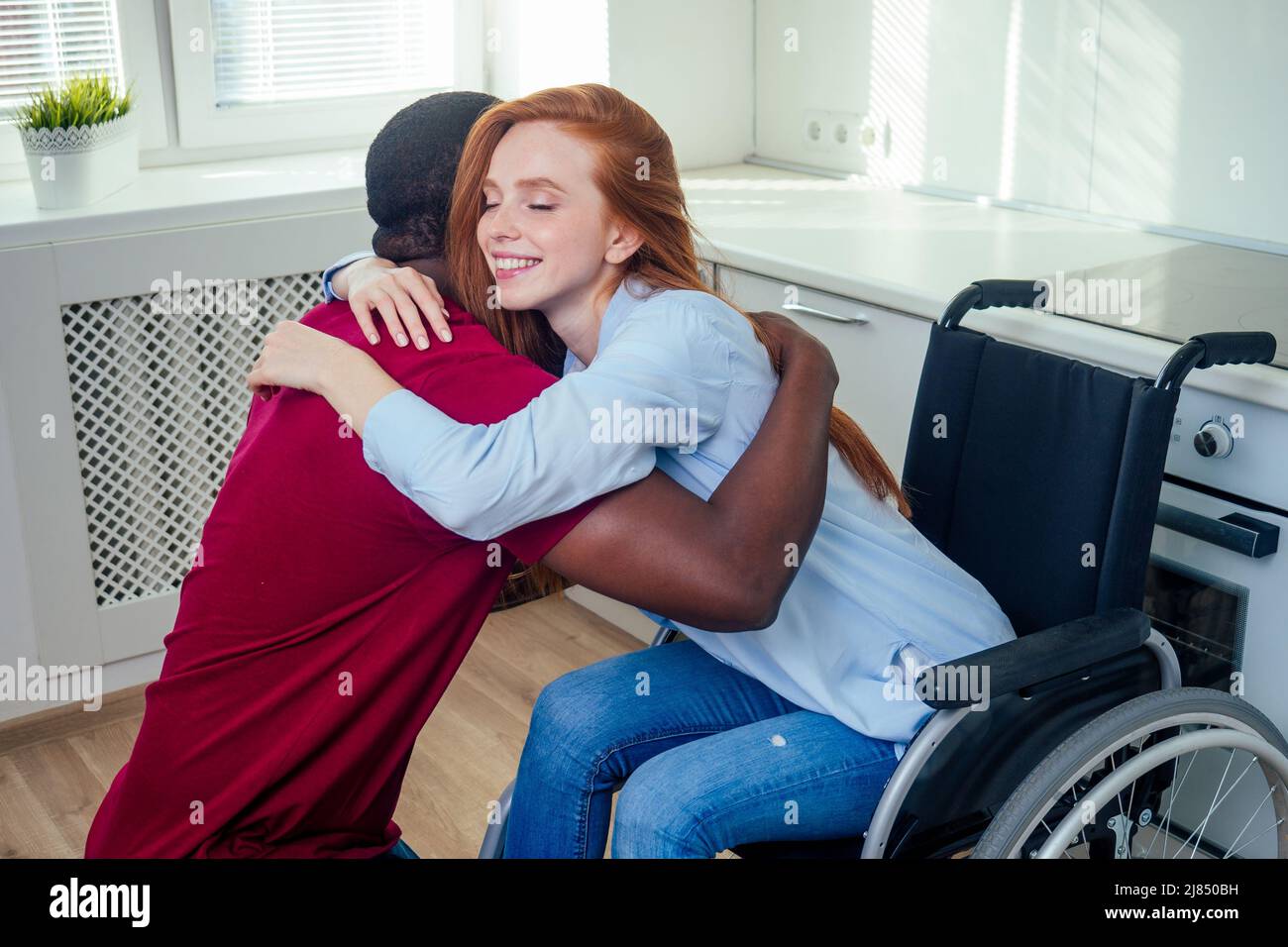 Young bearded handicapped redhaired ginger wife in wheelchair and her ...
