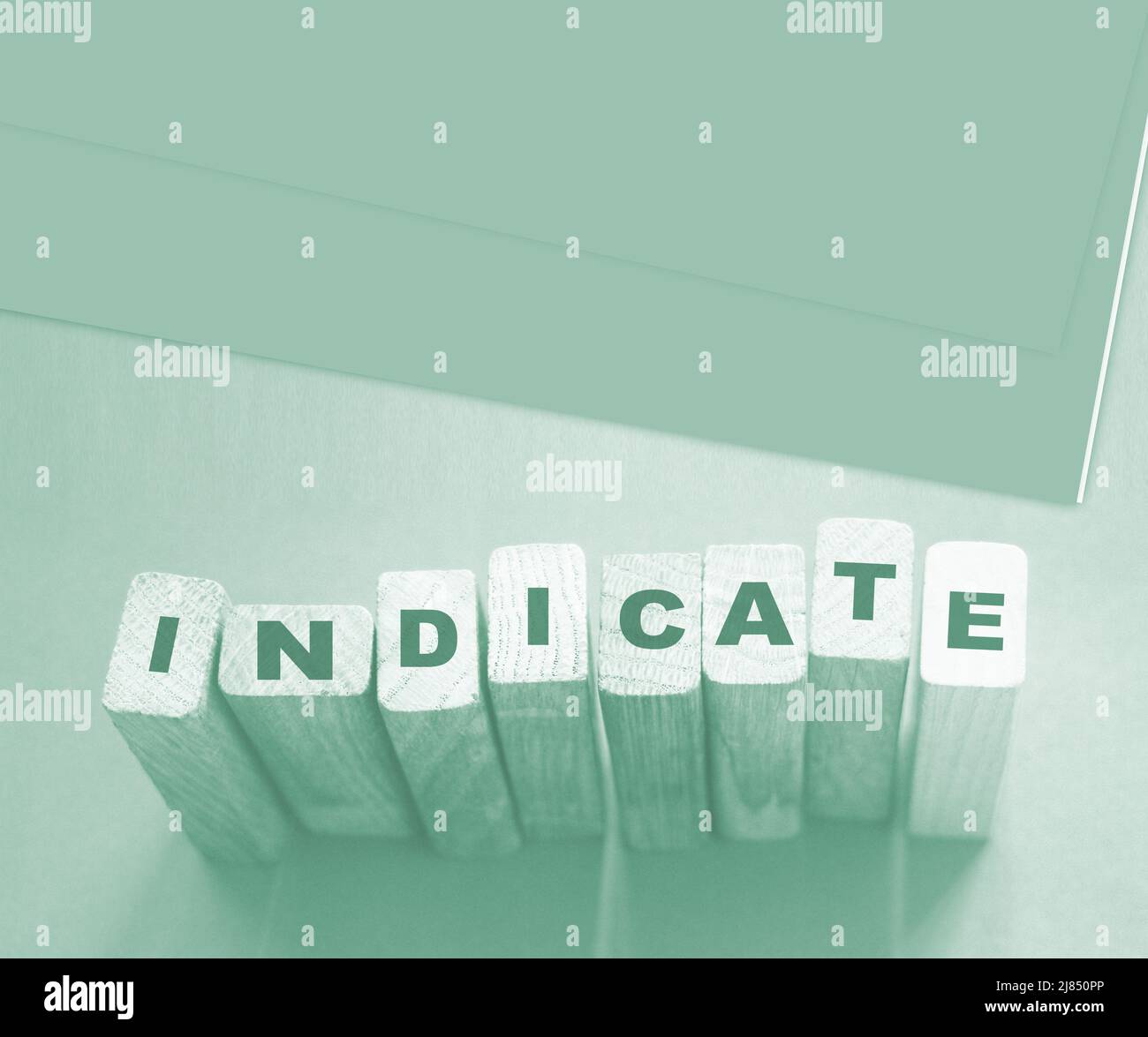 Indicate word on wooden blocks on cyan background. Financial indicator ...