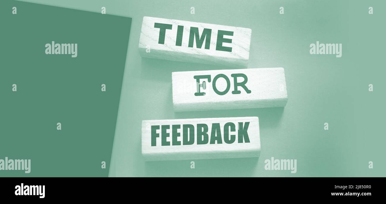 Time fir feedback text on wooden blocks. Product or service evaluation ...