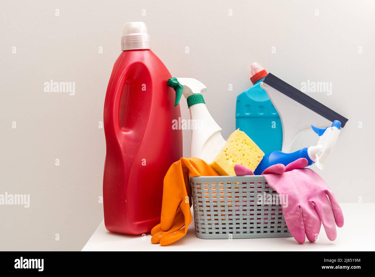 Assorted cleaning products on white background Stock Photo - Alamy