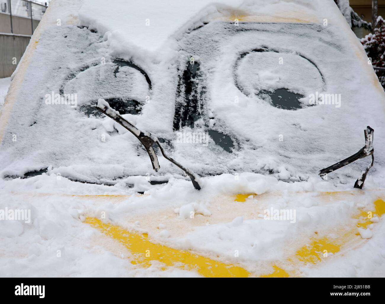 funny face shape in a snow covered car Stock Photo - Alamy