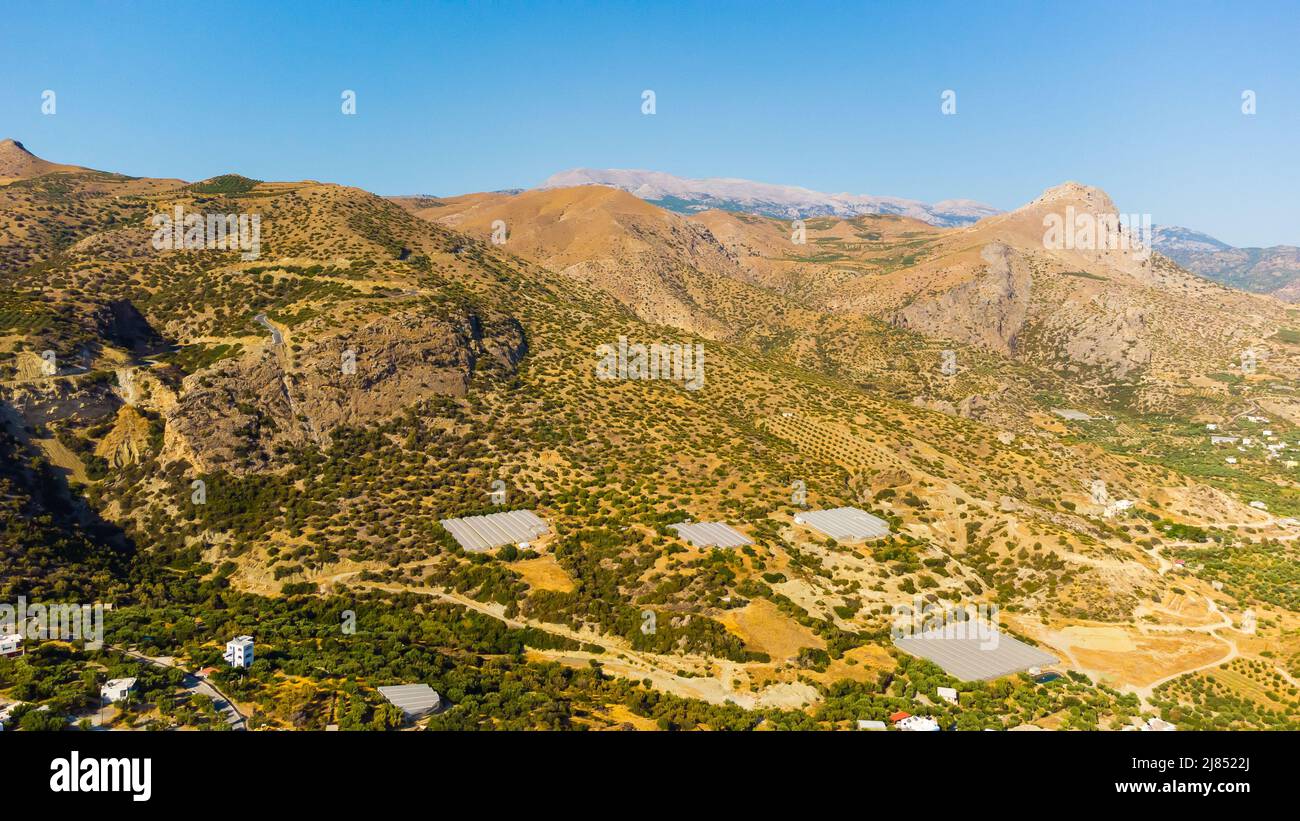 Greece, Crete, landscape with olive trees and tiny mountain village ...