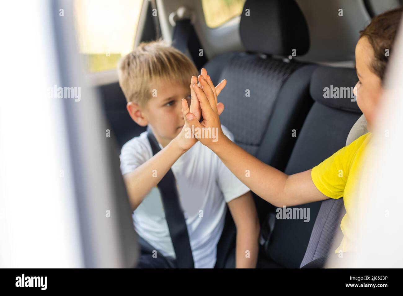 Happy kids, adorable toddler girl with teenager brother sitting ...