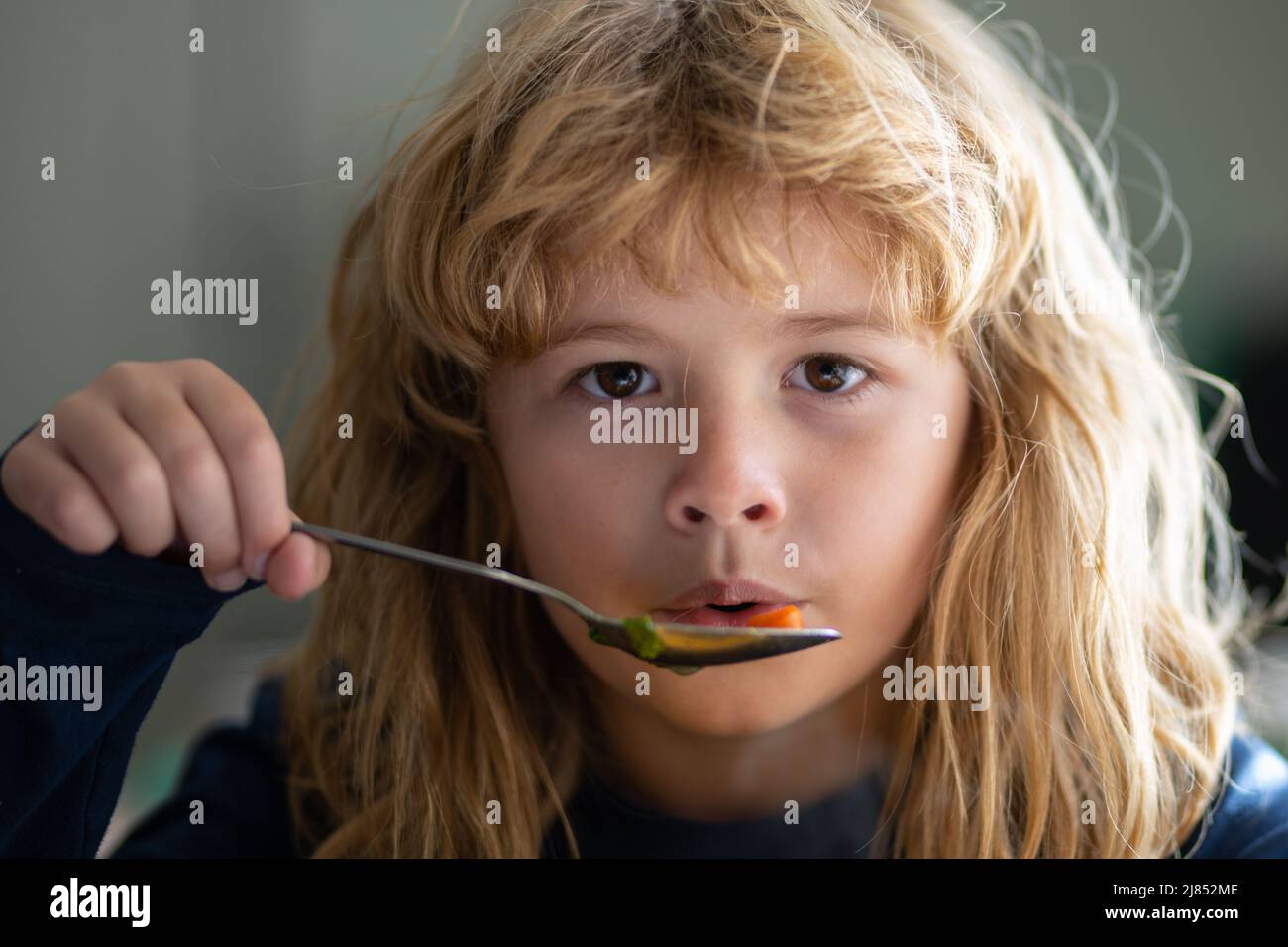 Child have a breakfast. Tasty kids breakfast. Adorable little school ...