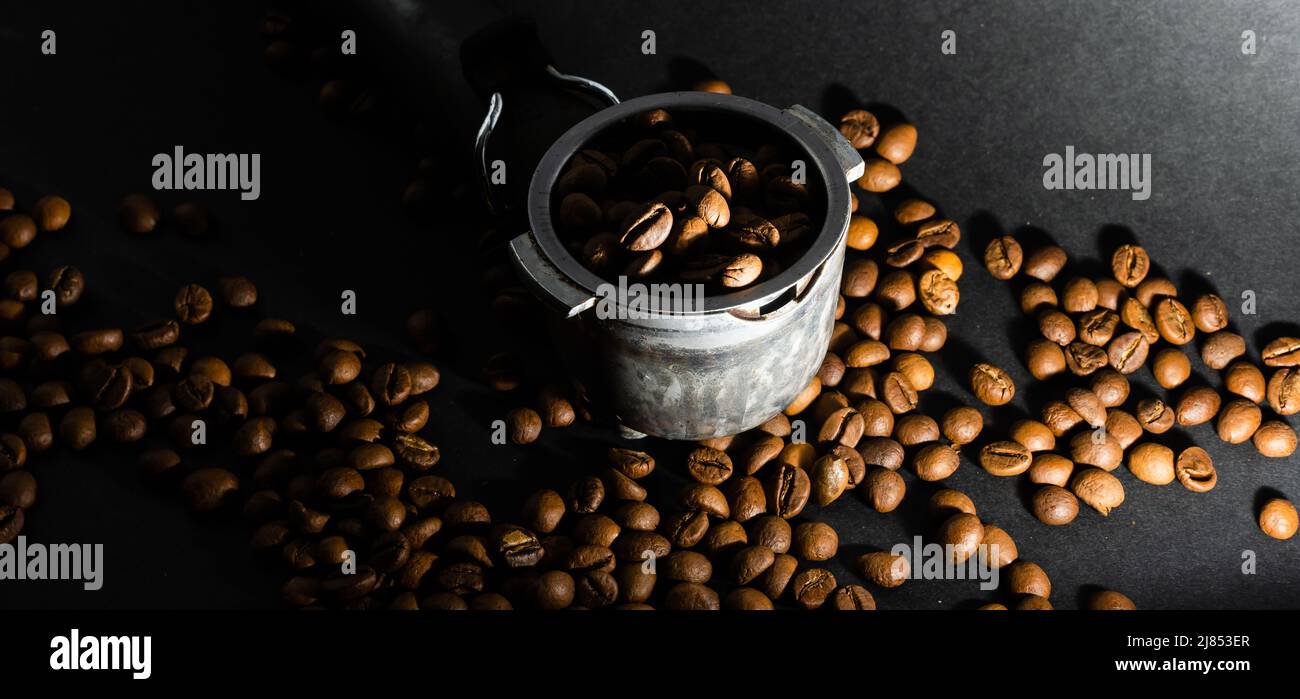 Coffee beans in the coffee horn on the background of coffee beans Stock ...