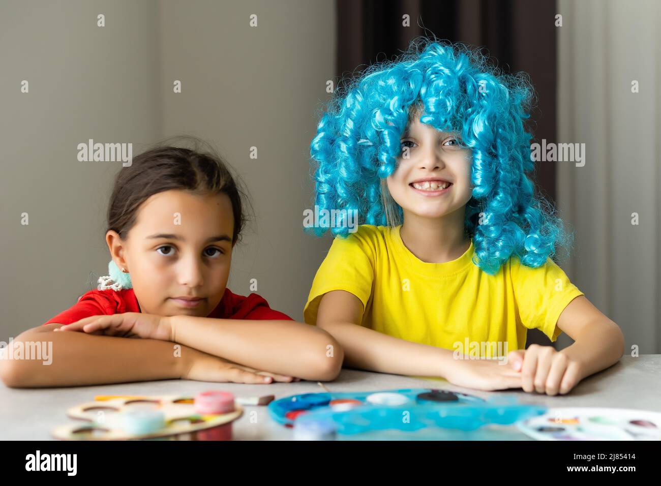 two little girls create craft at home Stock Photo - Alamy