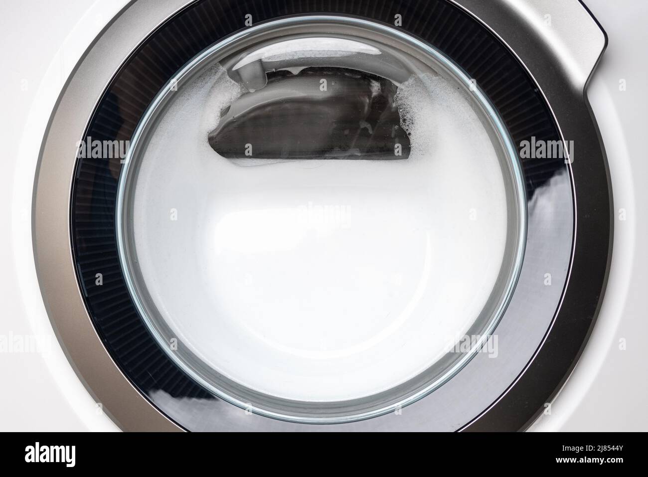 Washing machine is full of foam Stock Photo - Alamy
