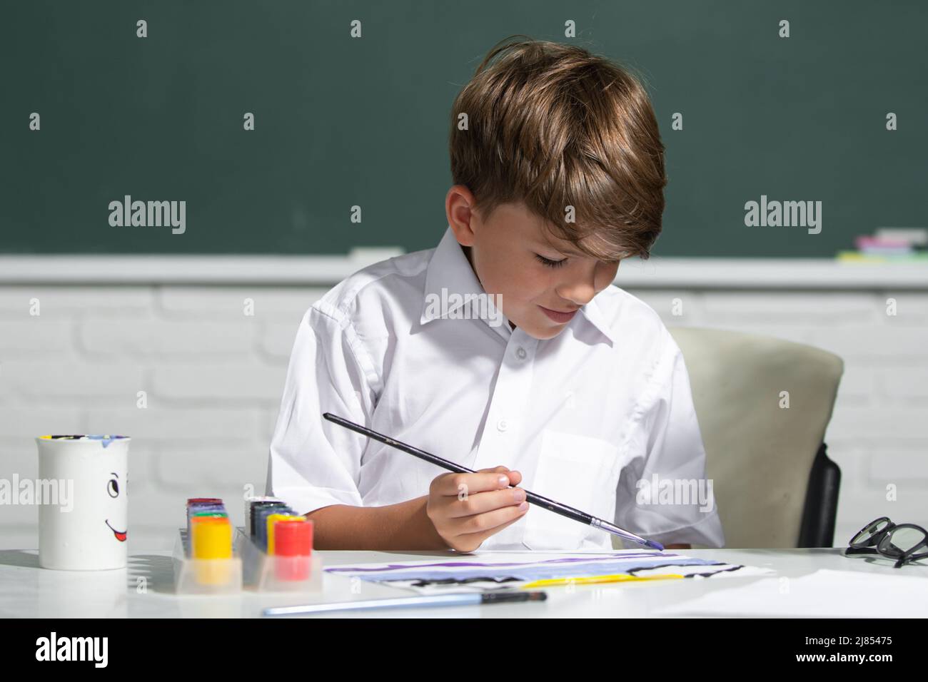 Child boy drawing with coloring pens, painting with early development ...
