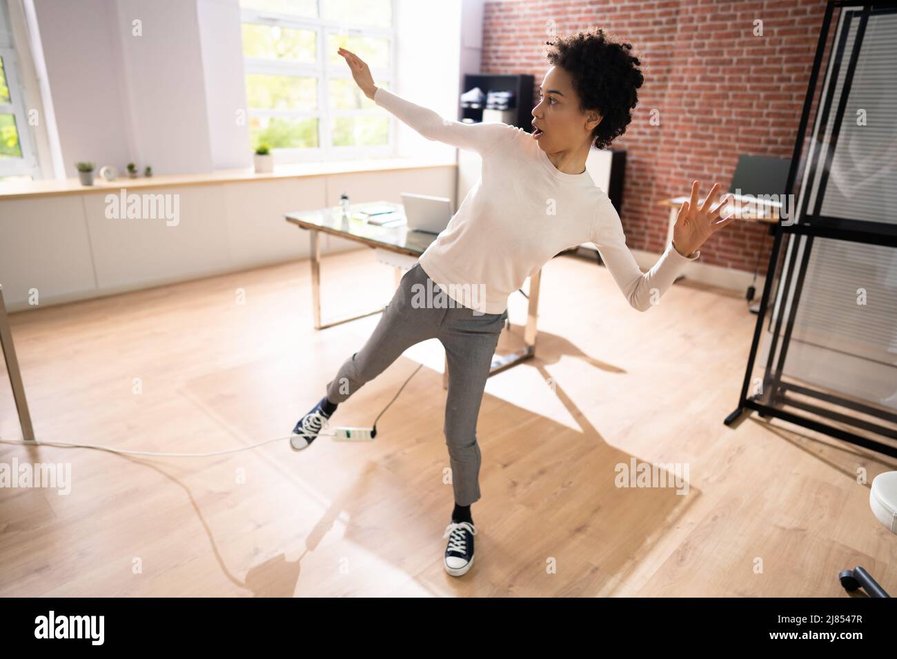 Stumble And Fall Over Wire In Office Stock Photo - Alamy