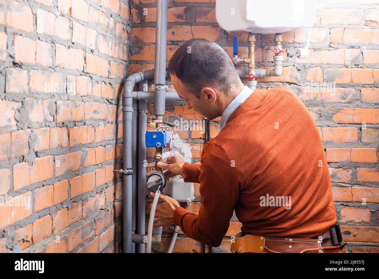 industrial heat engineer worker plumber at boiler room installation ...