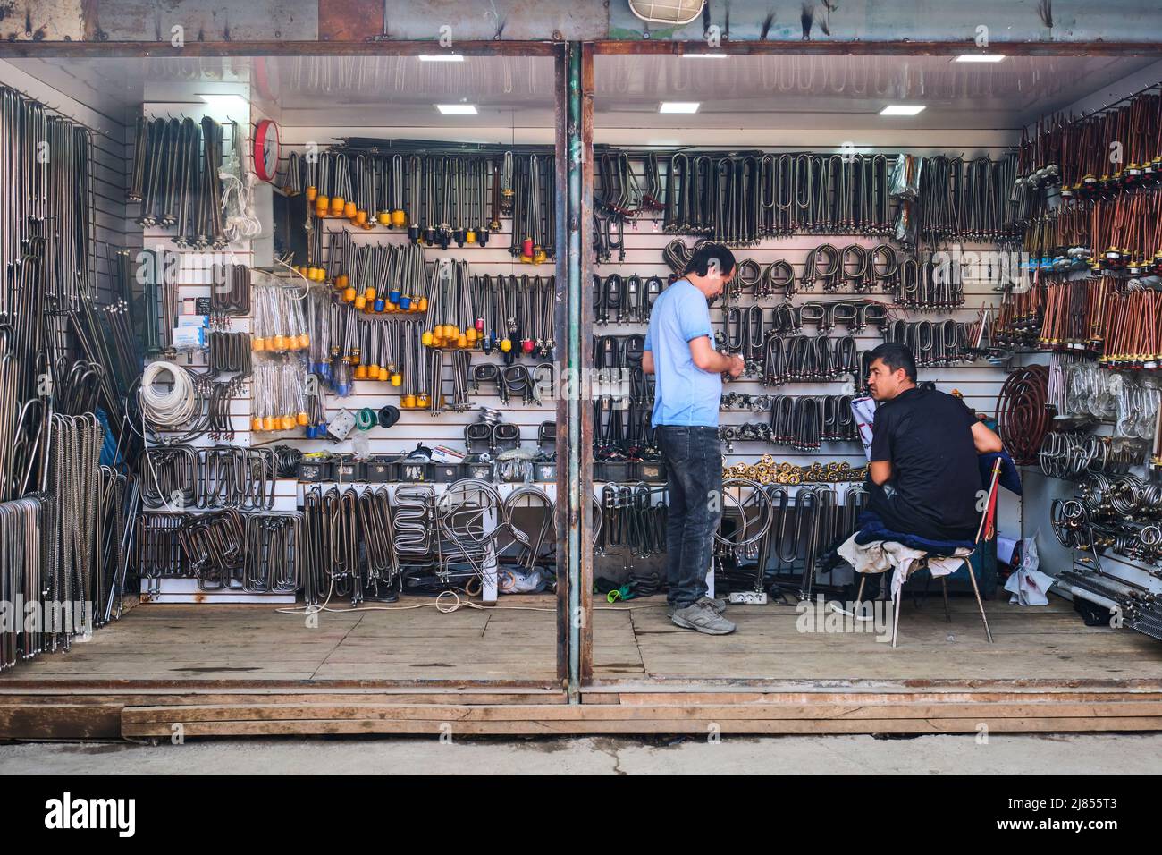 A store, stall that sells piping. At the Yangiobod Bozor market in ...