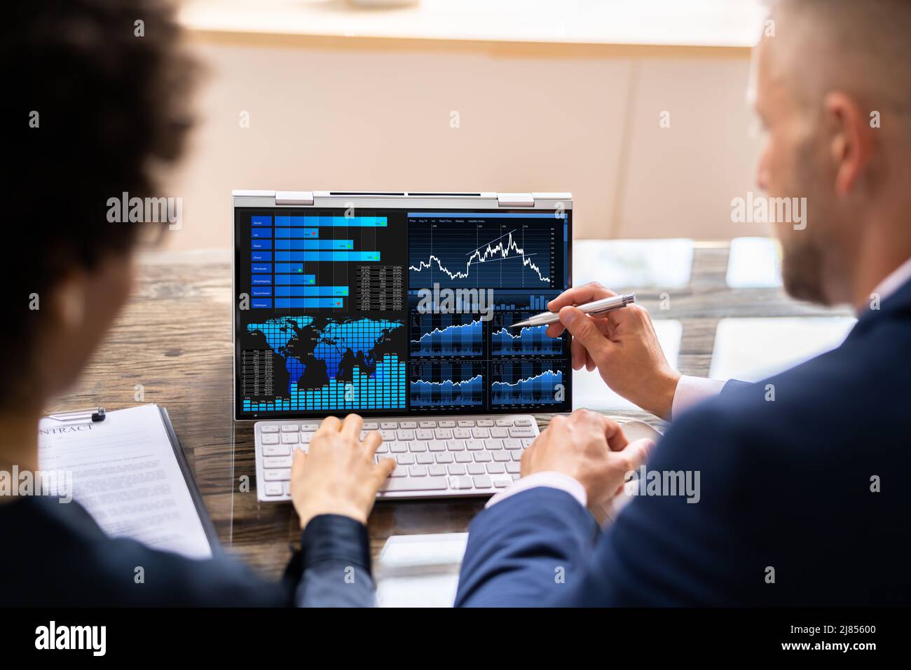 Two man analyzing financial data hi-res stock photography and images ...