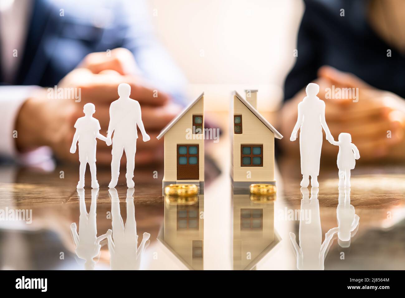 Wife And Husband Splitting Children And House During Divorce Process ...