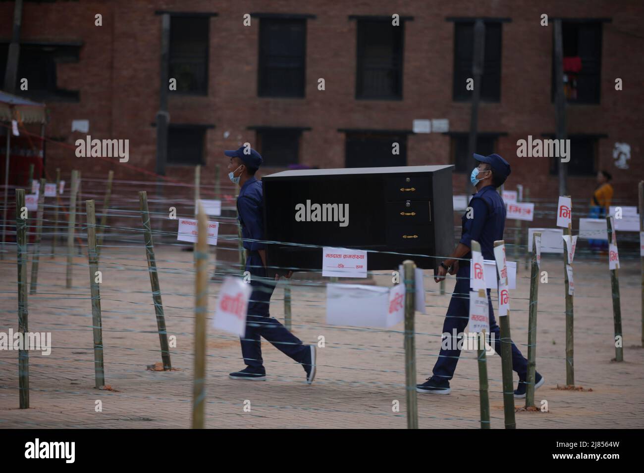Kathmandu, Nepal. 13th May, 2022. Temporary Myadi Police carry a table ...
